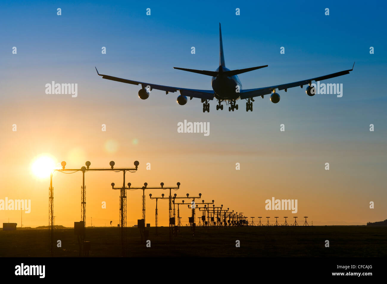 Boing 747 landing at sunset Stock Photo - Alamy