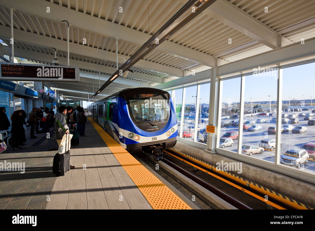 Passengers wait board CanadLine light rapid Stock Photo - Alamy Passengers wait board CanadLine light rapid Stock Photo - Alamy