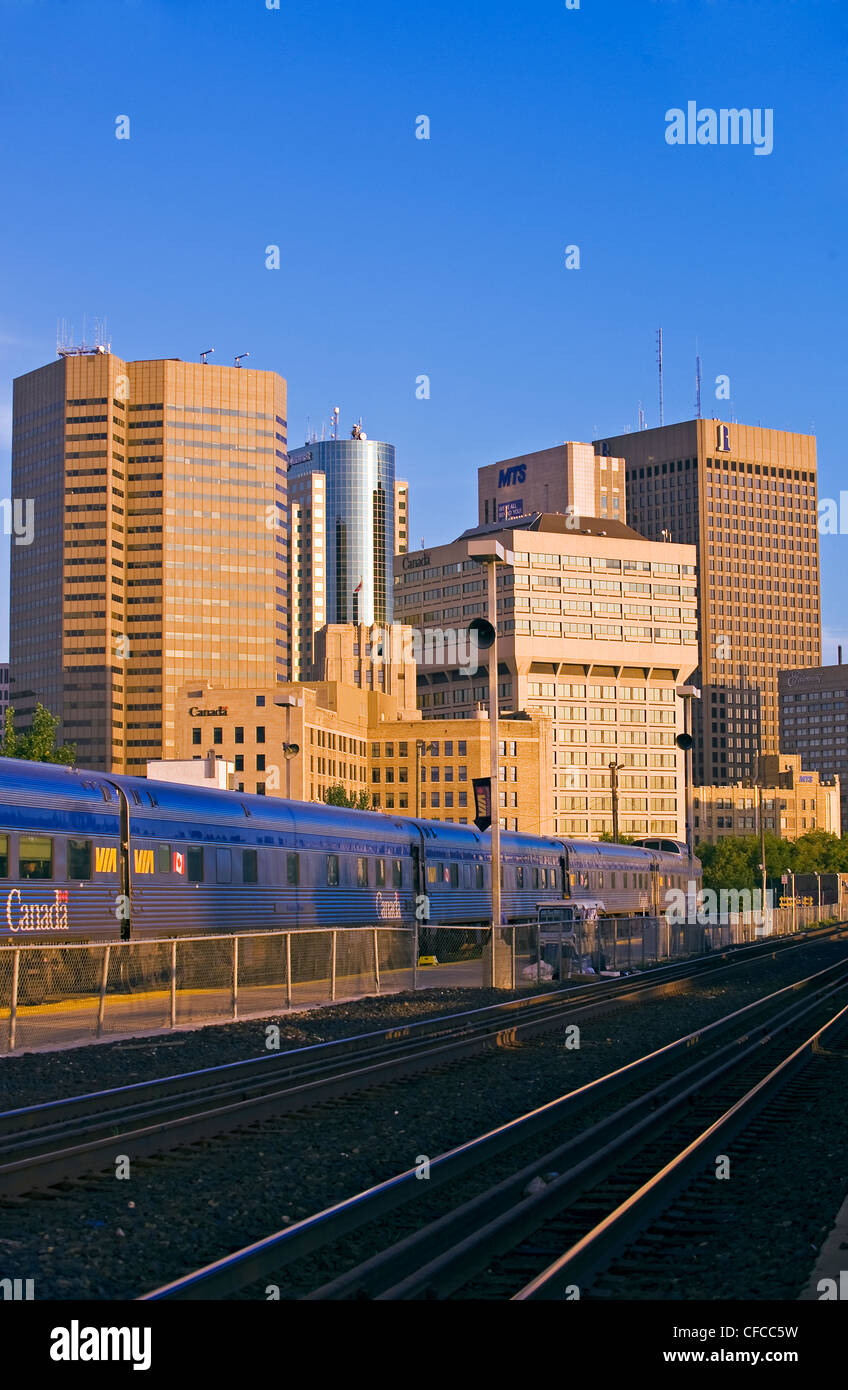 Via rail train at station, downtown Winnipeg skyline, Manitoba, Canada ...