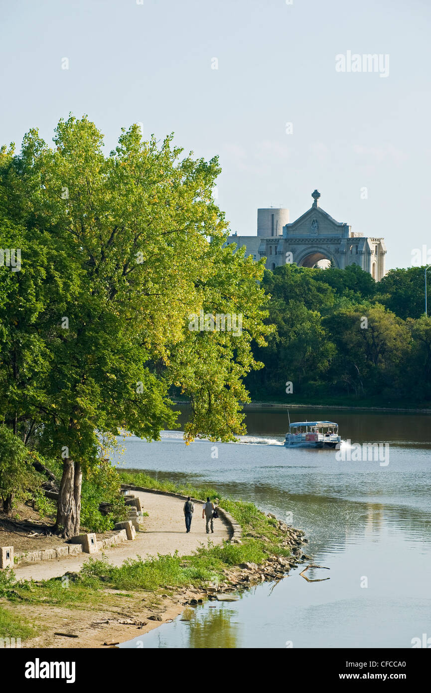 tour boat on the Red River with the walkway along the Red River in the ...