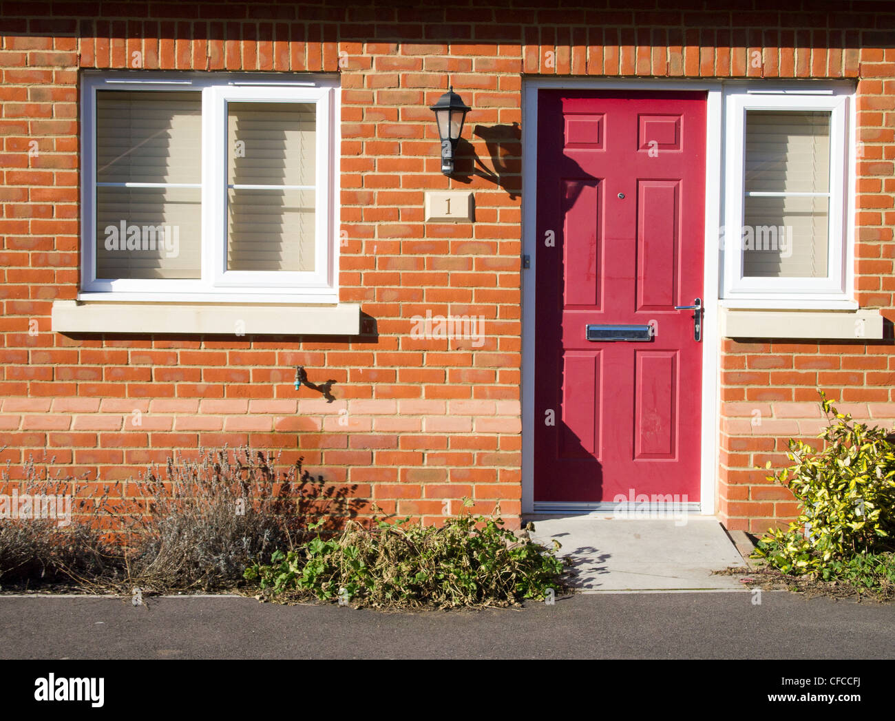 The ground floor front of a house, with the blinds on its windows shut ...
