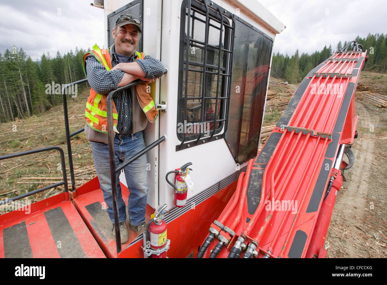 An operator atop his grapple loader or "Hoe-Chucker", Sayward, Cambell ...