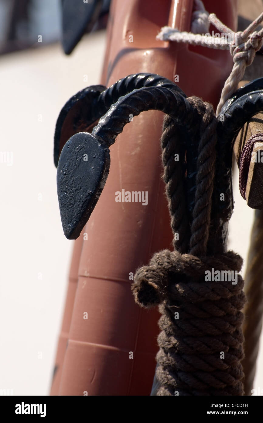 A anchor wrapped in a rope Stock Photo - Alamy