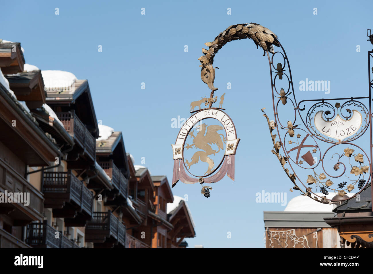 Ornate metal signs hanging on building walls in Courchevel 1850 France ...