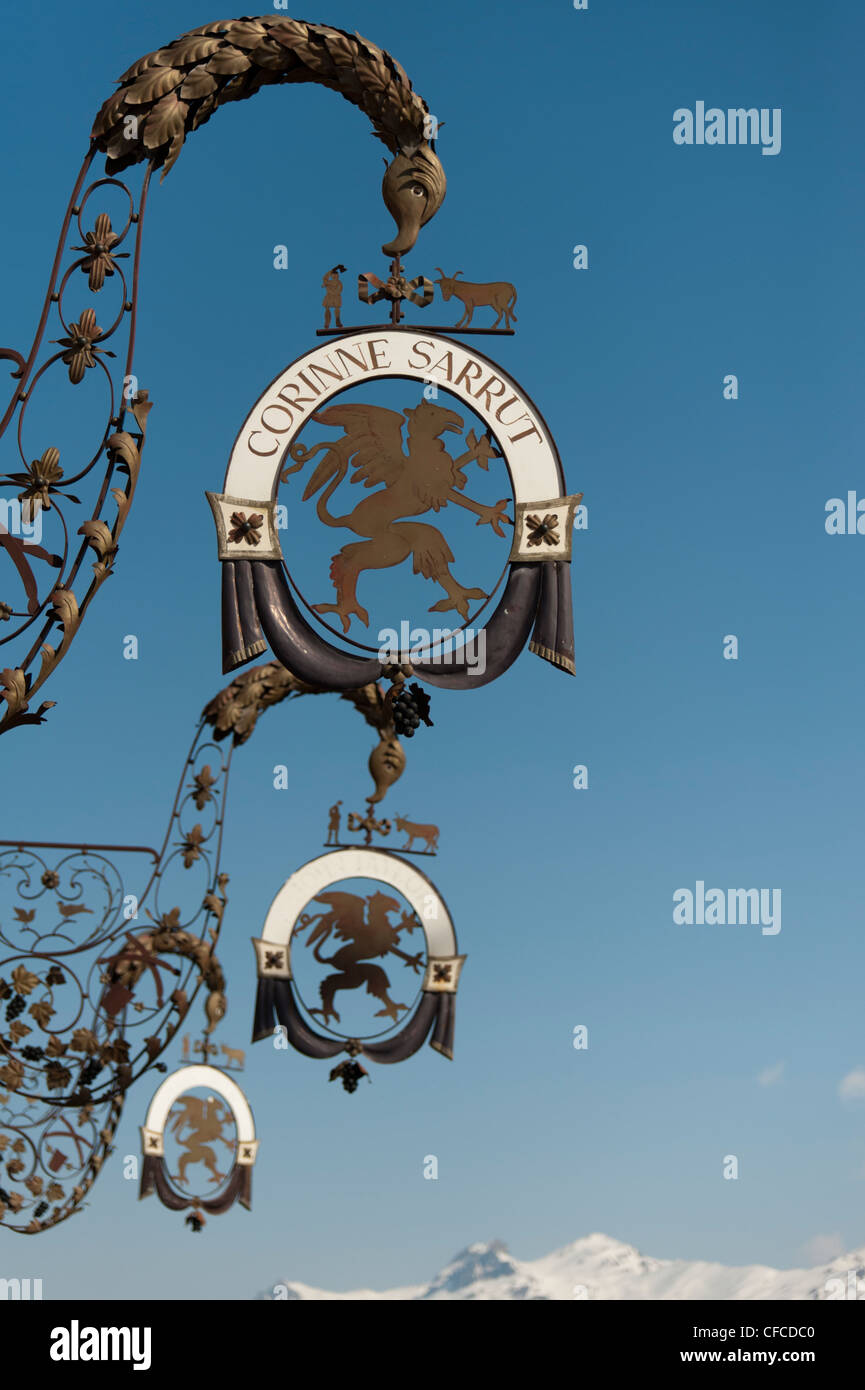 Ornate metal signs hanging on building walls in Courchevel 1850 France ...