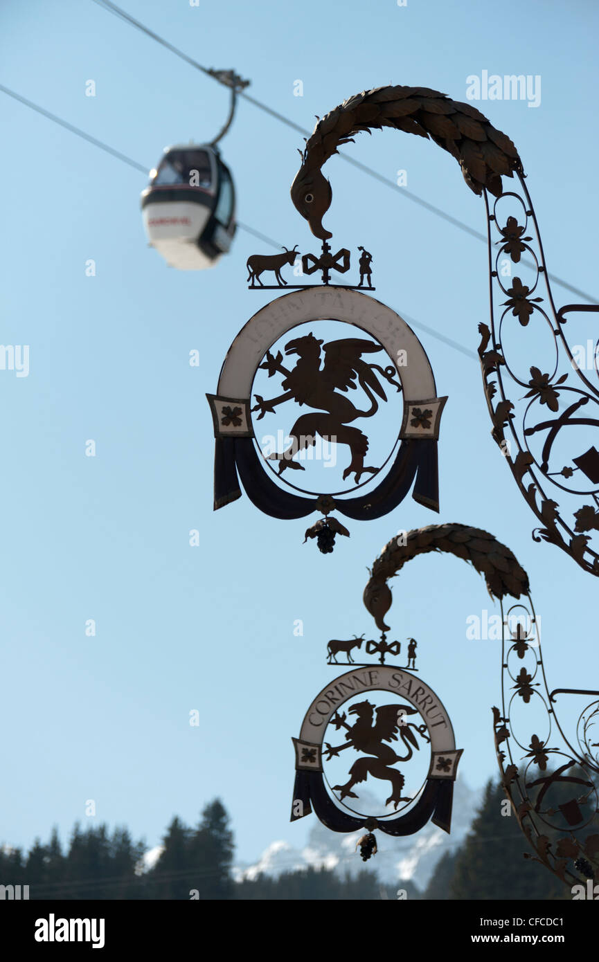 Ornate metal signs hanging on building walls in Courchevel 1850 France ...