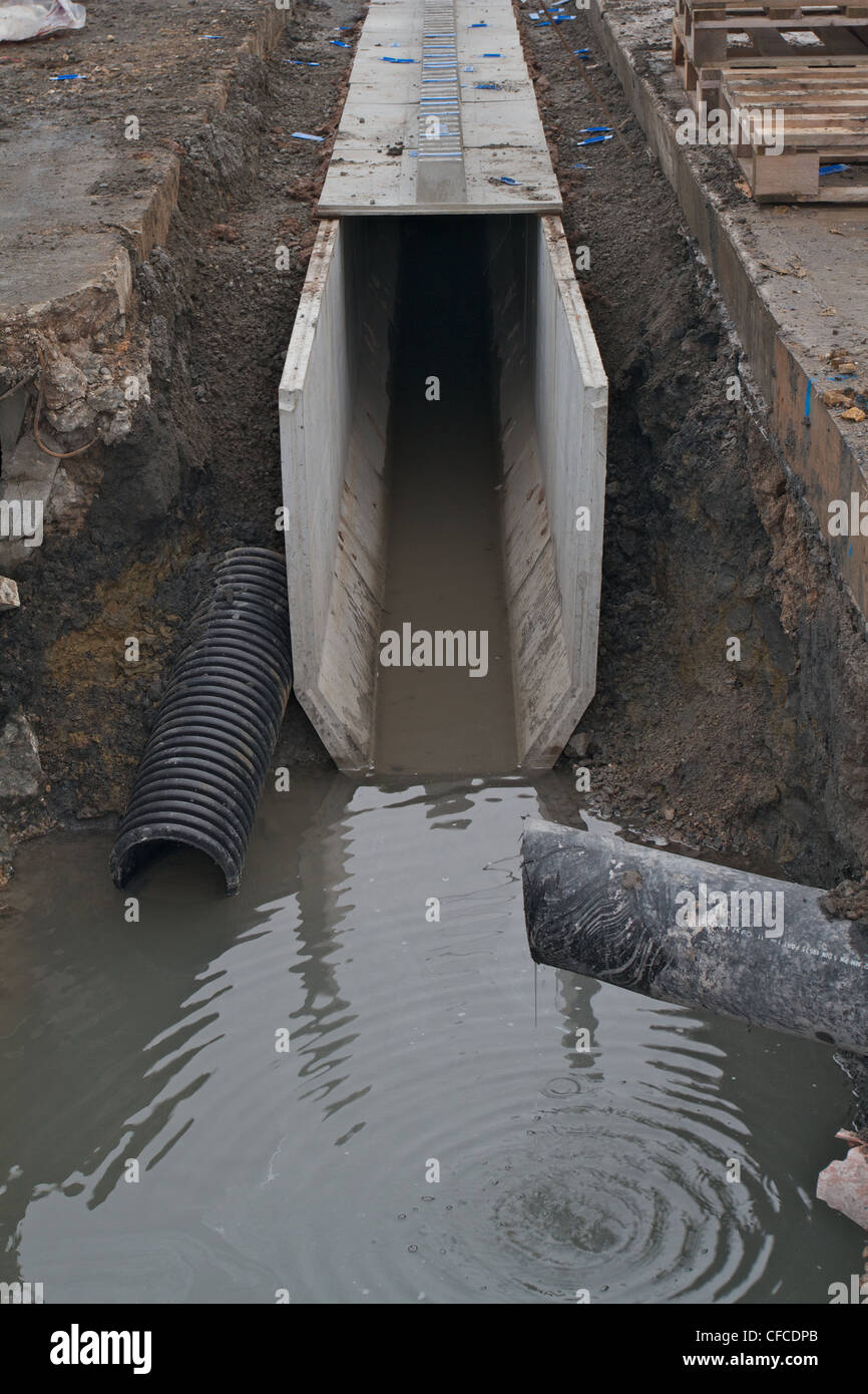 Decathlon linear slot drainage system installation Stock Photo - Alamy