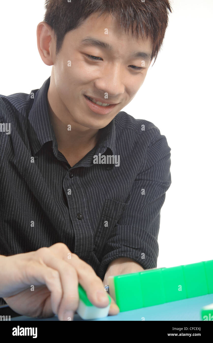 Chinese man play Mahjong, traditional China gamble Stock Photo - Alamy