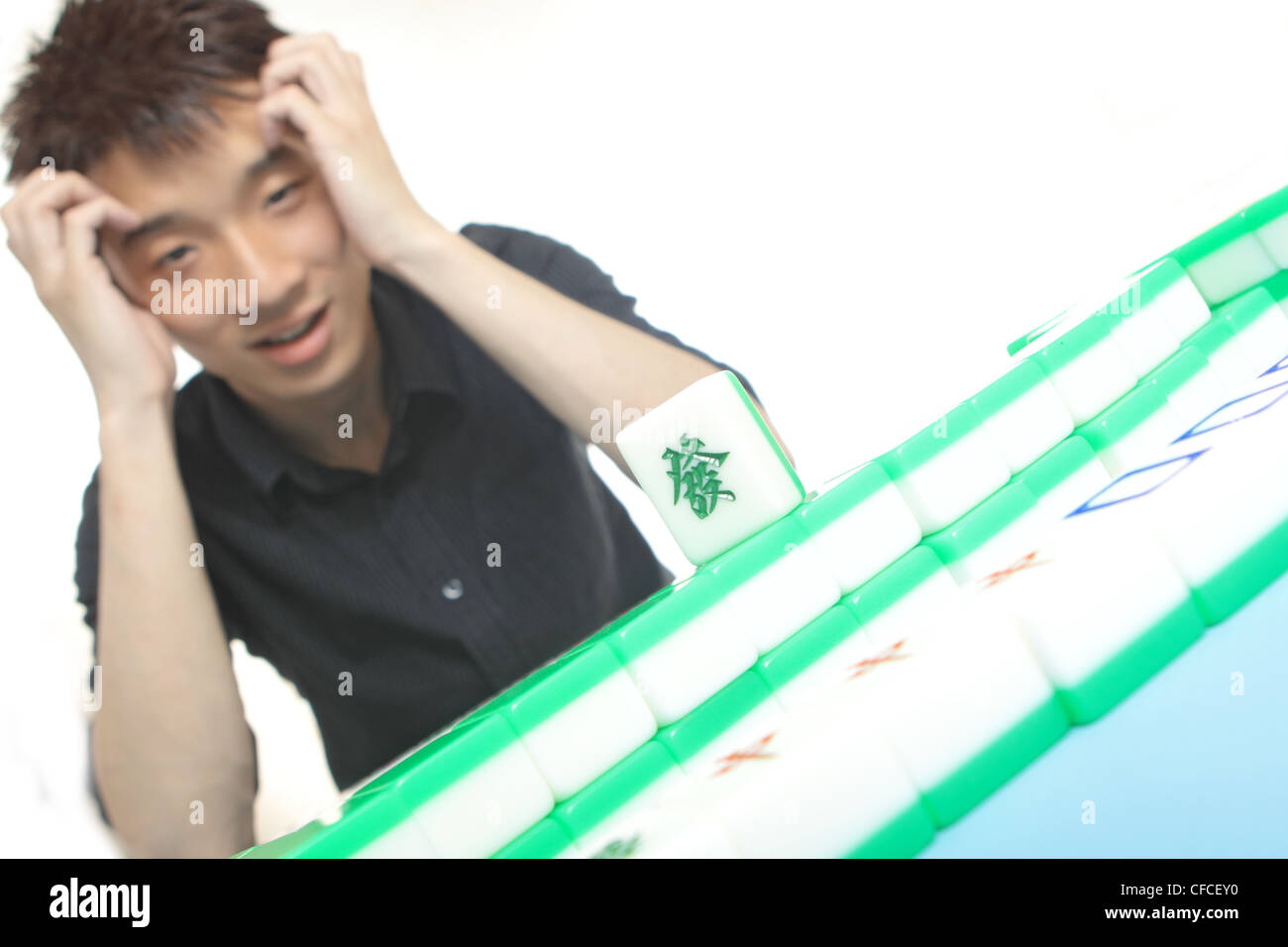 Chinese man play Mahjong, traditional China gamble Stock Photo - Alamy