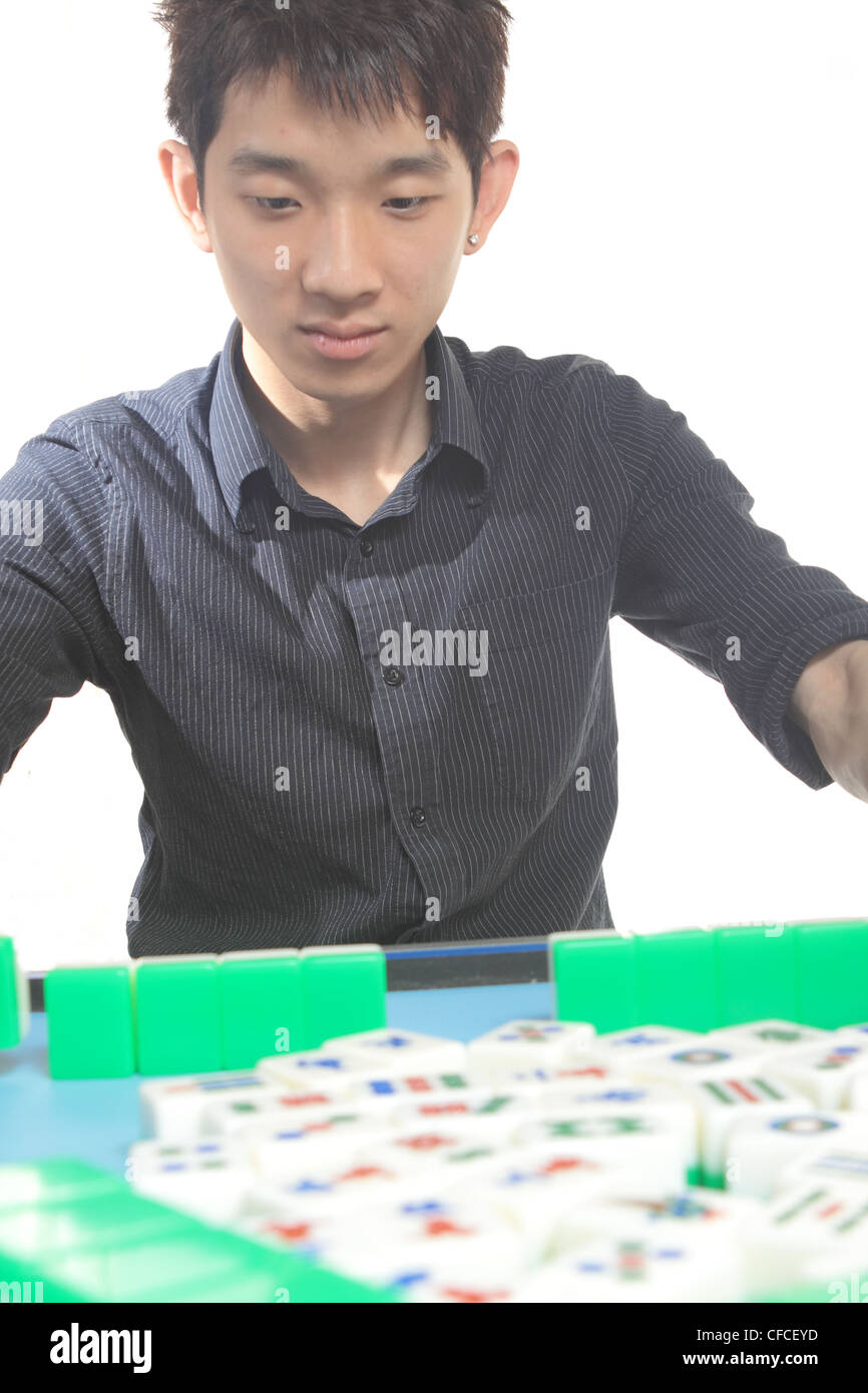 Chinese man play Mahjong, traditional China gamble Stock Photo - Alamy