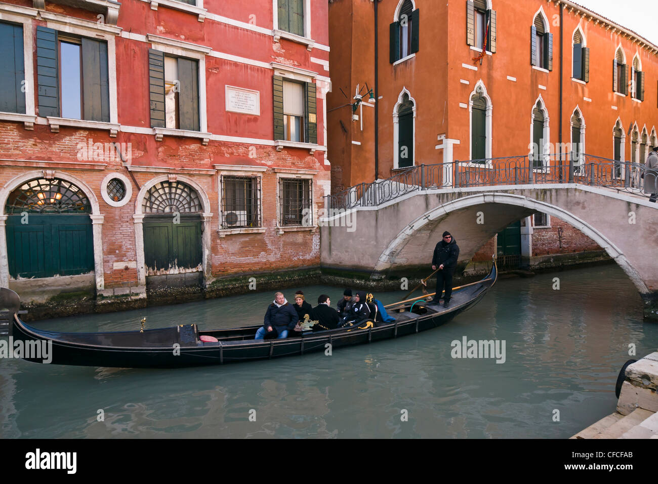 Tourists enjoying a gondola ride on Rio San Luca canal - Venice ...