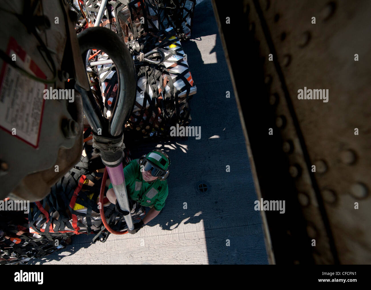 A Sailor on the deck of the Military Sealift Command fast combat ...