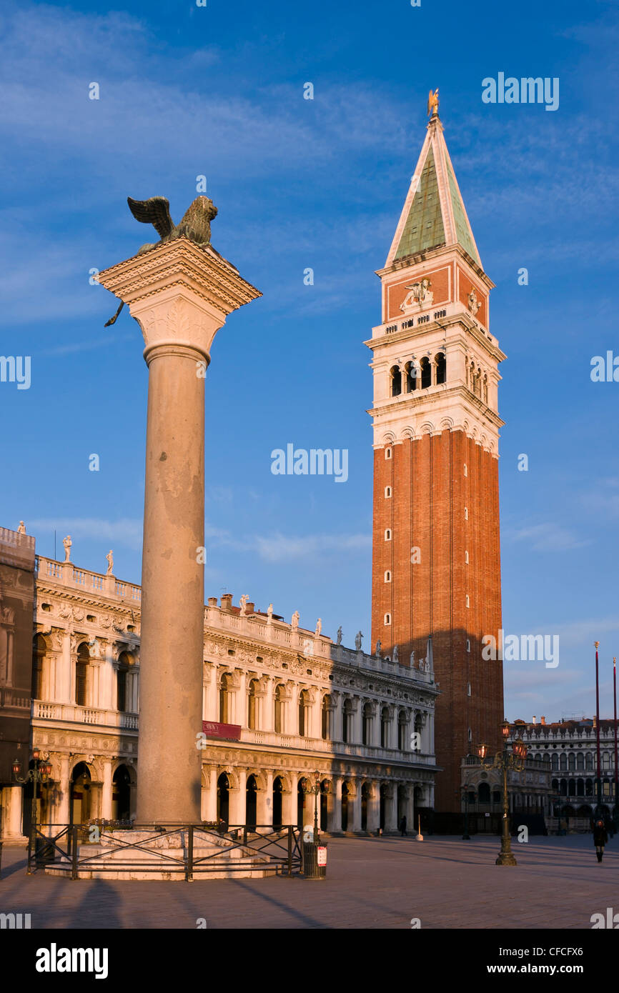 Campanile bell tower and Winged Lion column at dawn in Saint Mark's ...