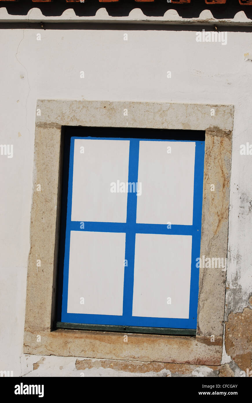 a blue crossed window in Portugal Stock Photo - Alamy