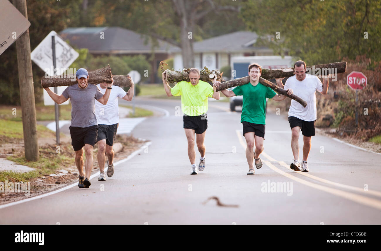 Men carrying log hi-res stock photography and images - Alamy