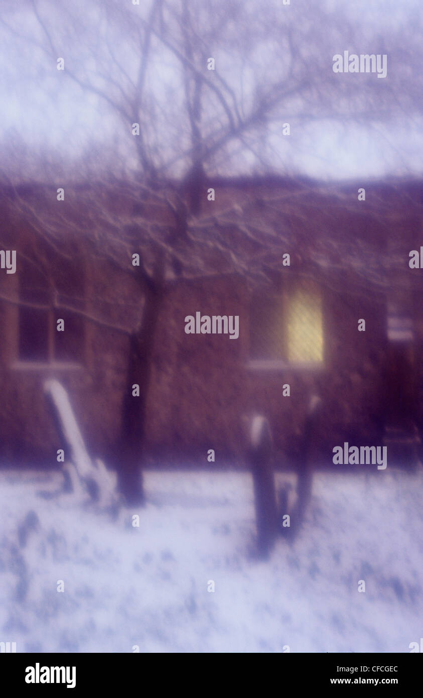 Atmospheric view of part of flint Early English Gothic church with snow ...