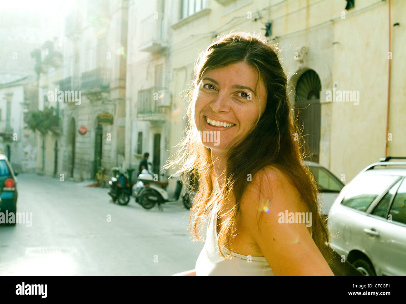 Young happy woman spontaneous moment in street Stock Photo - Alamy