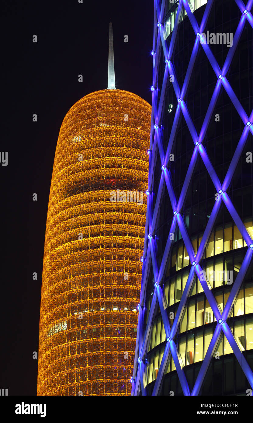 Burj Qatar and the blue illuminated QIPCO Tower in Doha, Qatar Stock ...