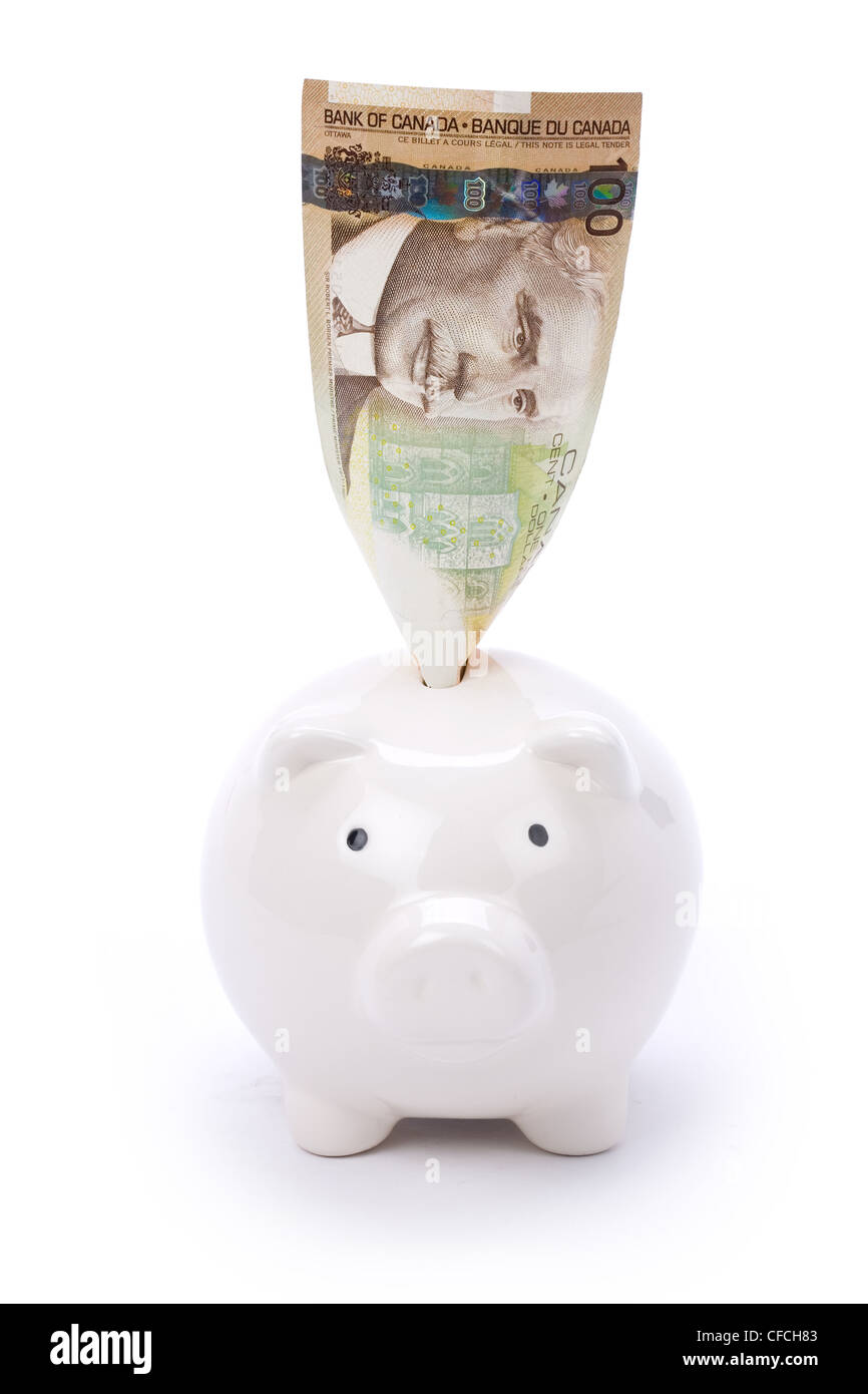 Piggy Bank and canadian dollars close up shot Stock Photo - Alamy