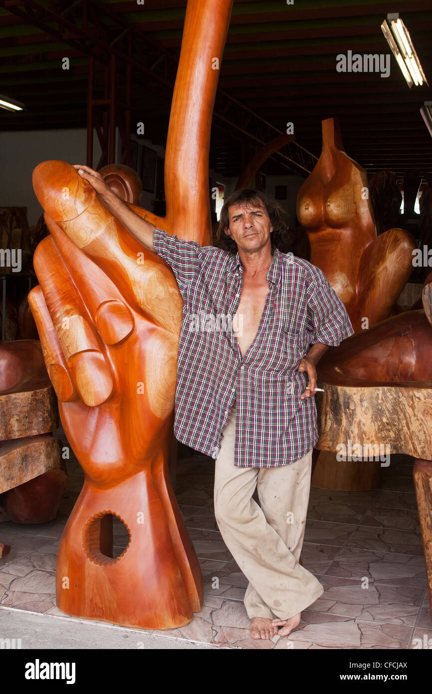 The sculptor of wooden statues displayed outside Gallery Original ...