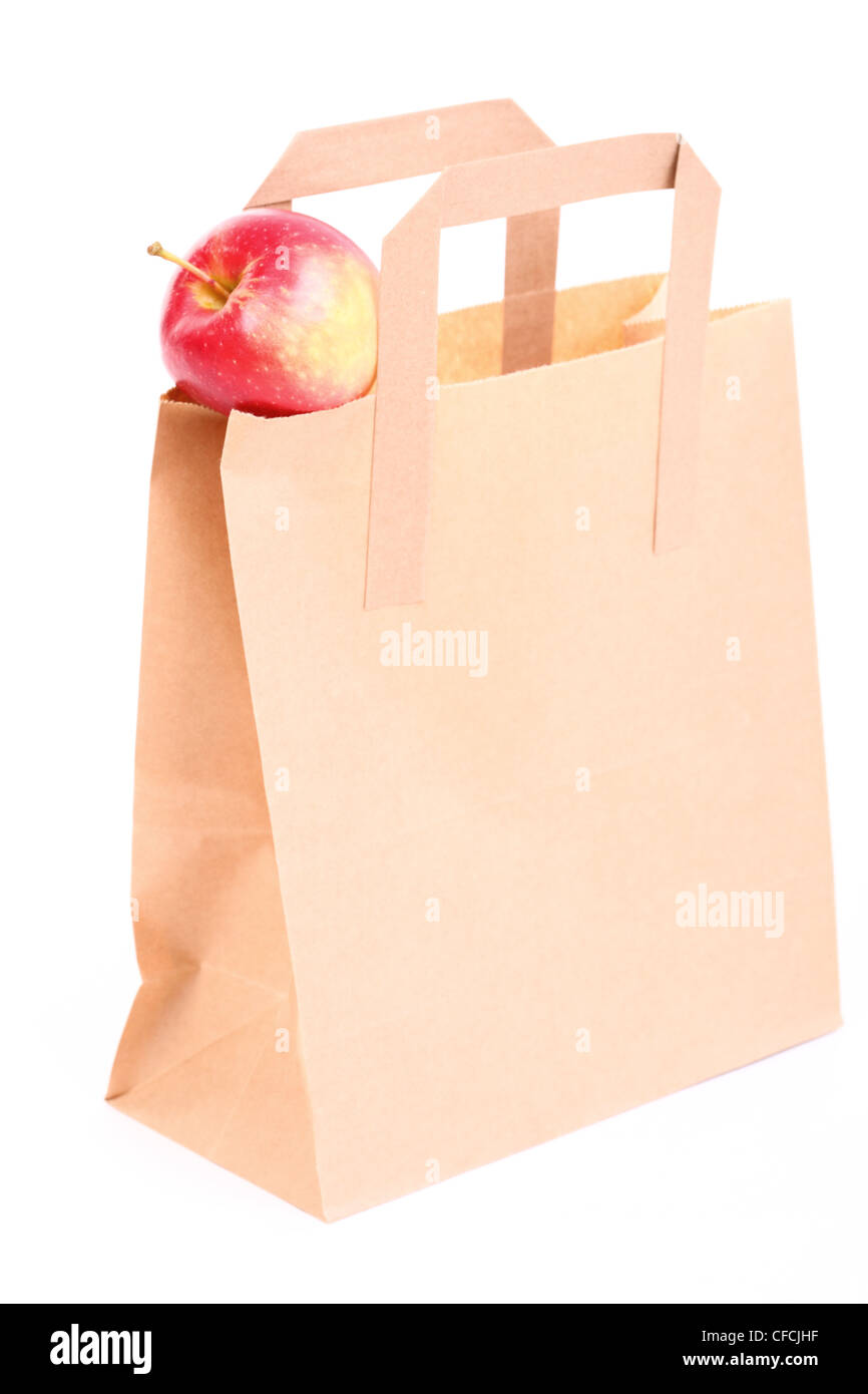 Shopping brown recycle gift bags and red apple isolated on white ...
