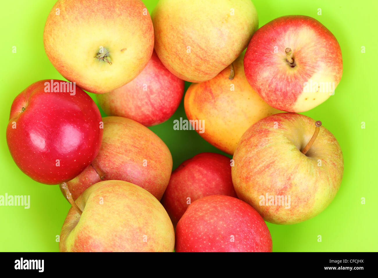 Fresh red apples in basket GREEN background Stock Photo - Alamy