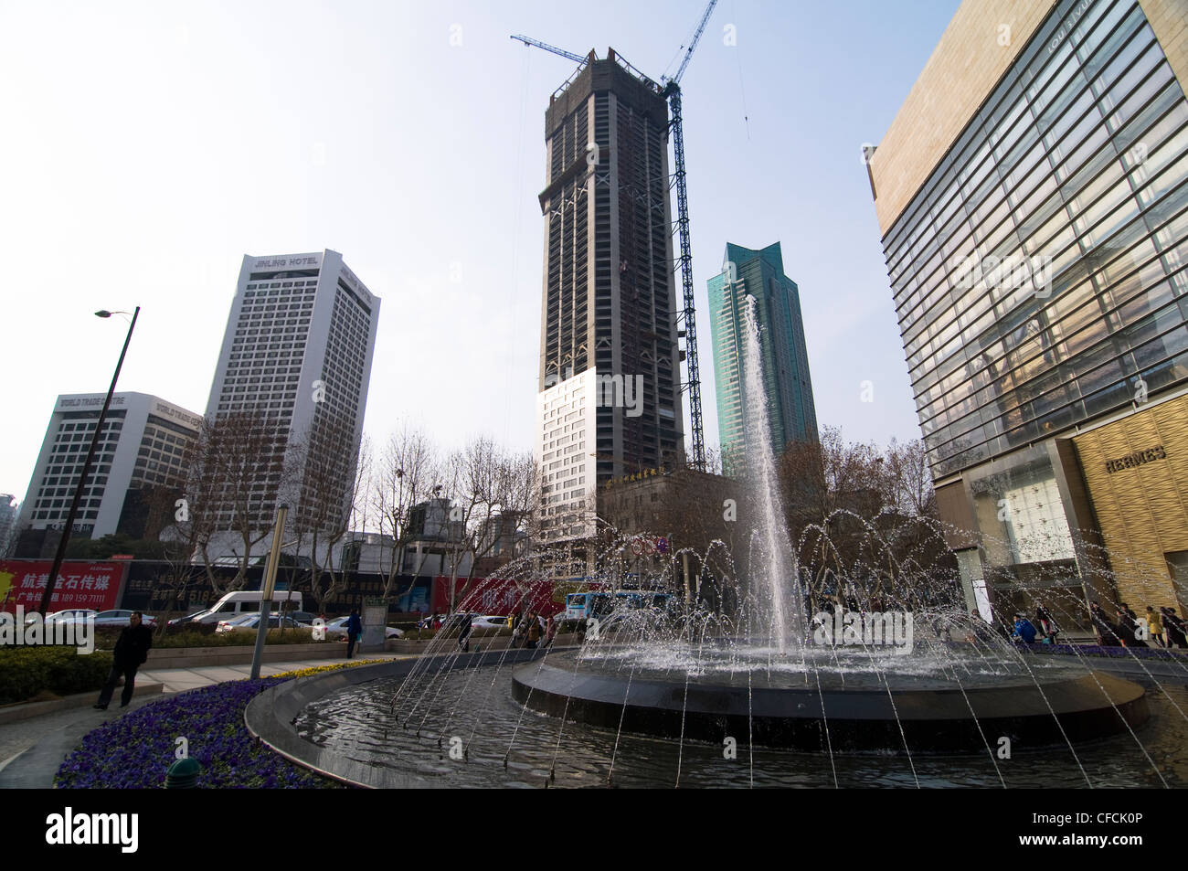 Downtown Nanjing is changing rapidly. cranes around new skyscrapers are ...