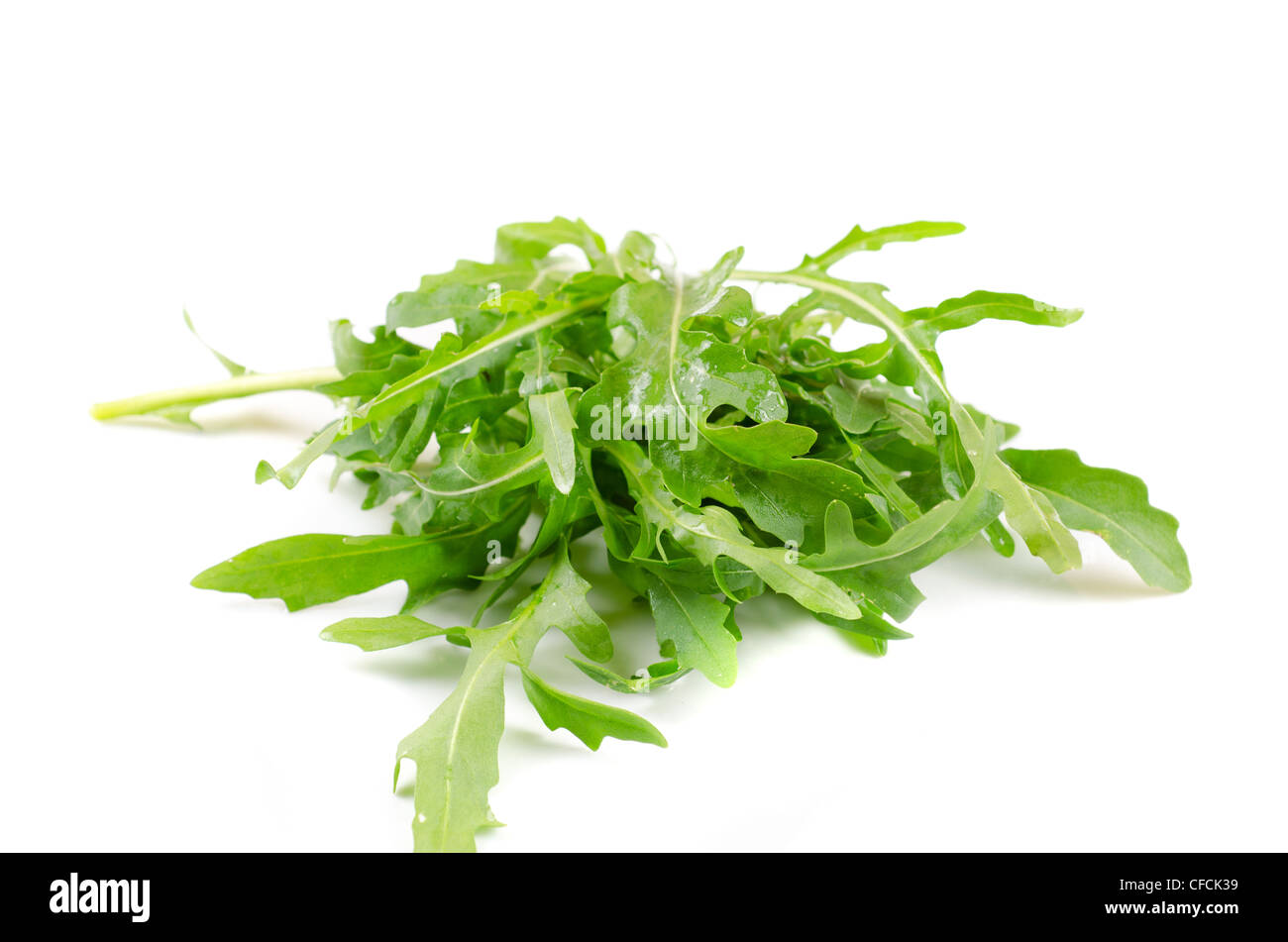 Ruccola salad fresh heap leaf isolated on a white Stock Photo - Alamy