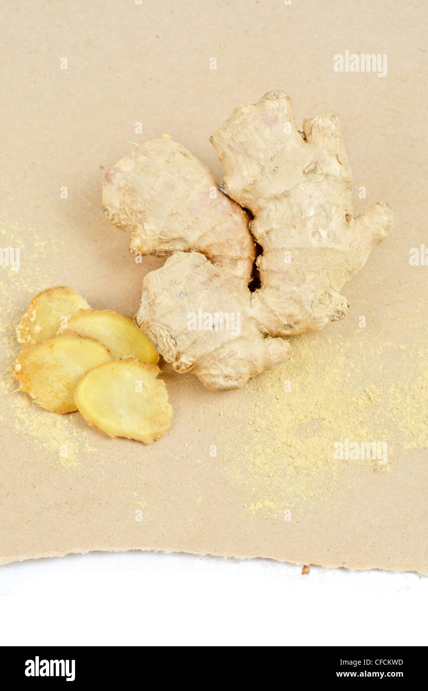Fresh, dried and powdered ginger at brown background Stock Photo - Alamy
