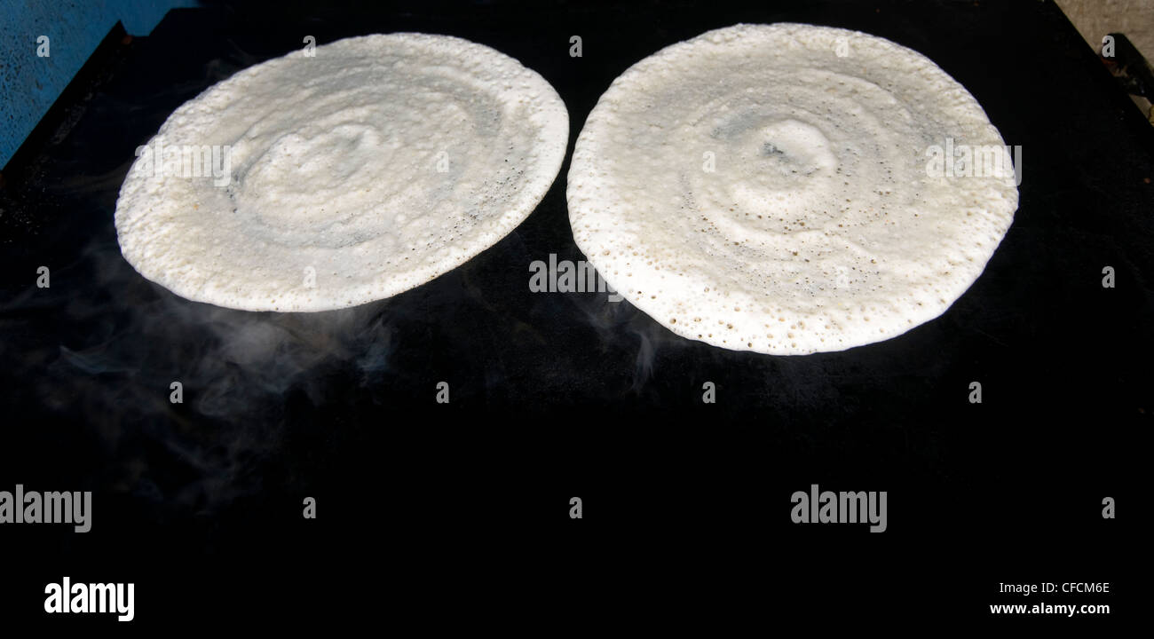 Masala Dosa being cooked on a big flat pan Stock Photo - Alamy