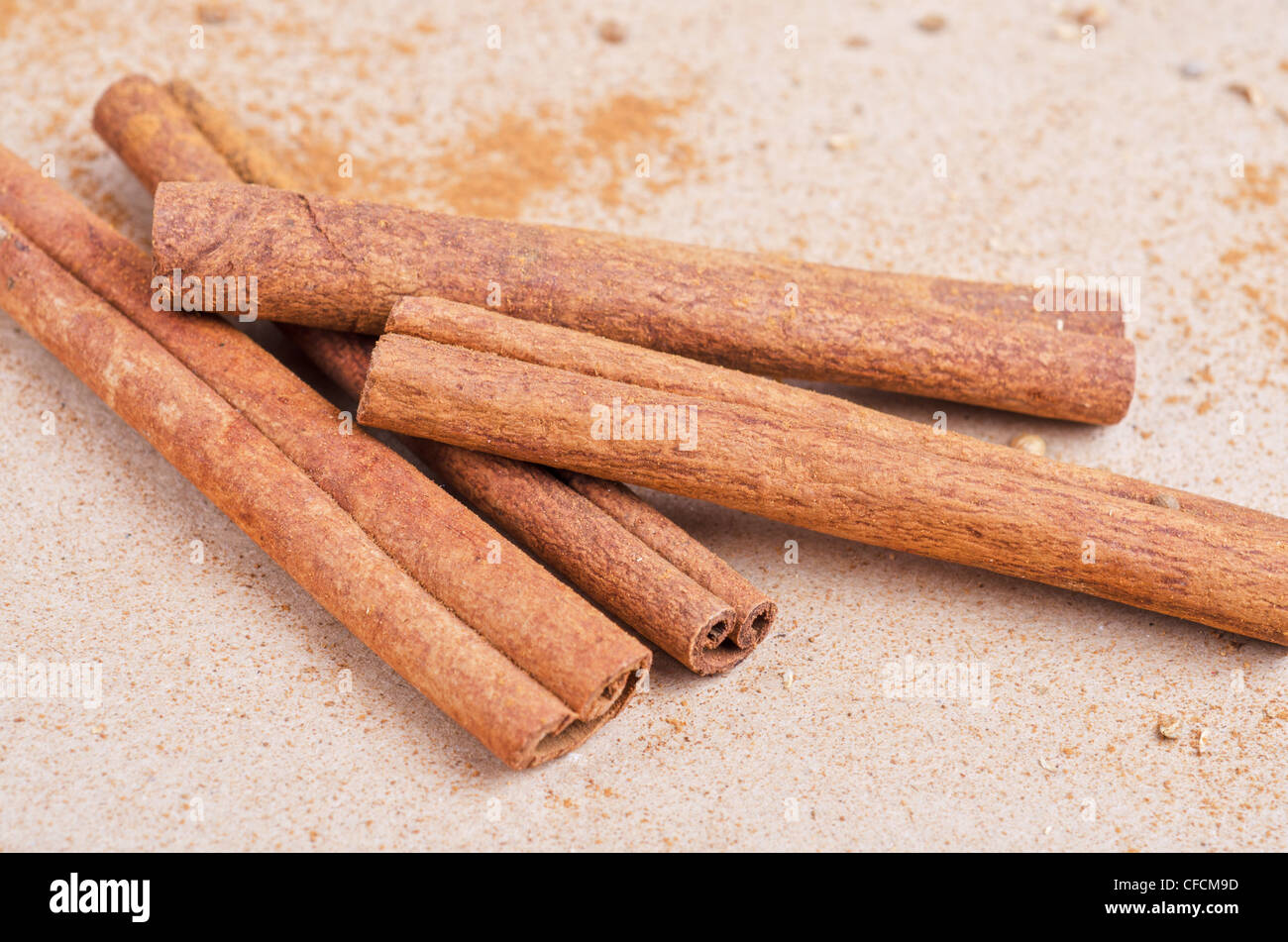 Cinnamon stick closeup on a brown background Stock Photo - Alamy