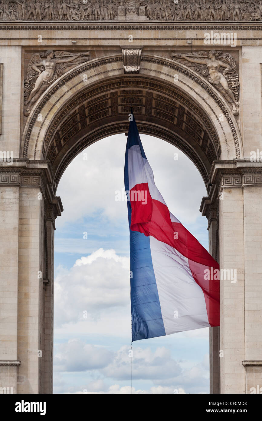 Arc de Triomphe detail and French flag on a sunny day Stock Photo - Alamy