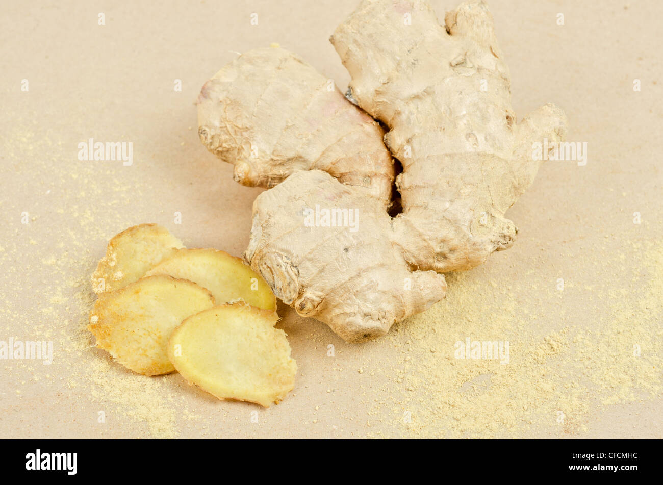 Fresh, dried and powdered ginger at brown background Stock Photo - Alamy