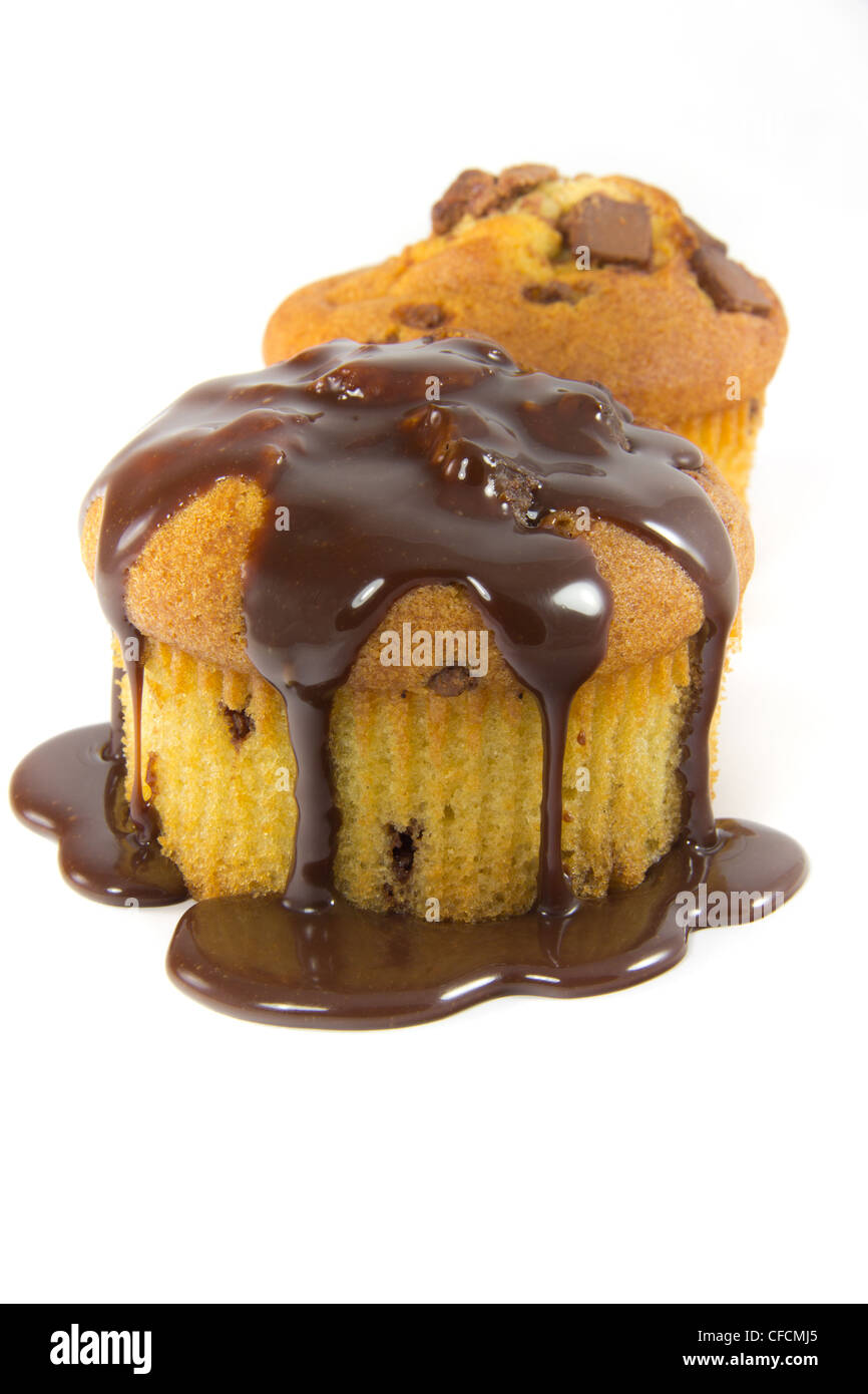 A picture of two muffins with melted chocolate toppings Stock Photo - Alamy