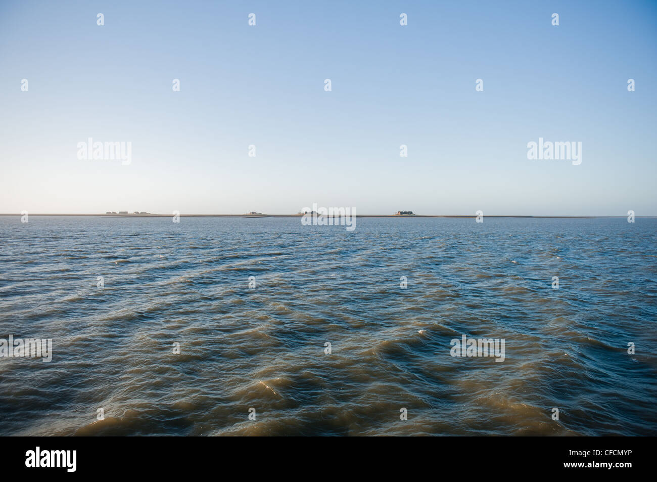 The homes of Hallig Hooge, a tiny wadden sea islands, are build on ...