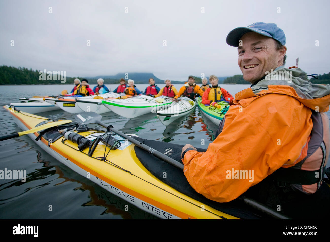 Kayak guide senior paddlers exploring arearound Stock Photo - Alamy