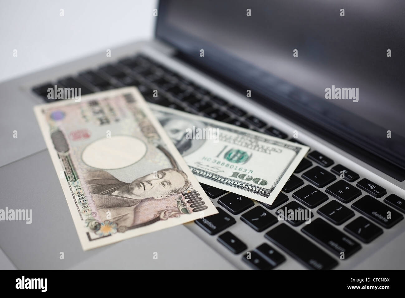 Computer keyboard and money Stock Photo - Alamy