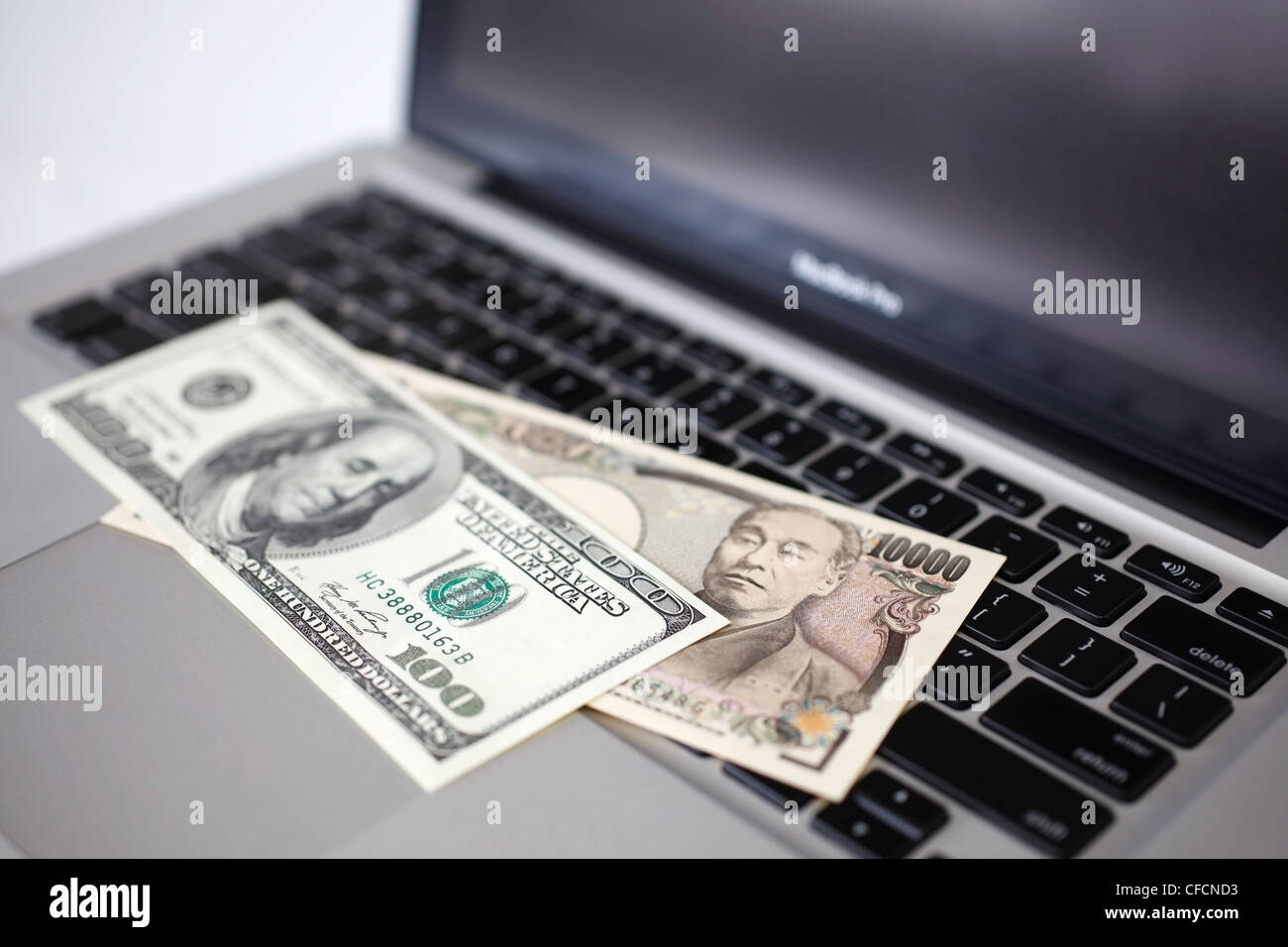 Computer keyboard and money Stock Photo - Alamy