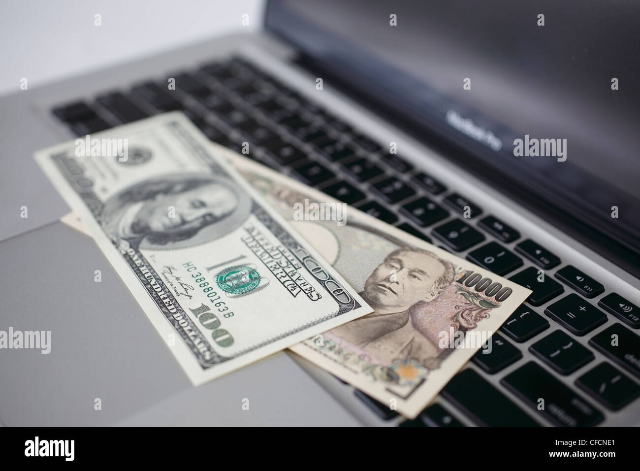 Computer keyboard and money Stock Photo - Alamy