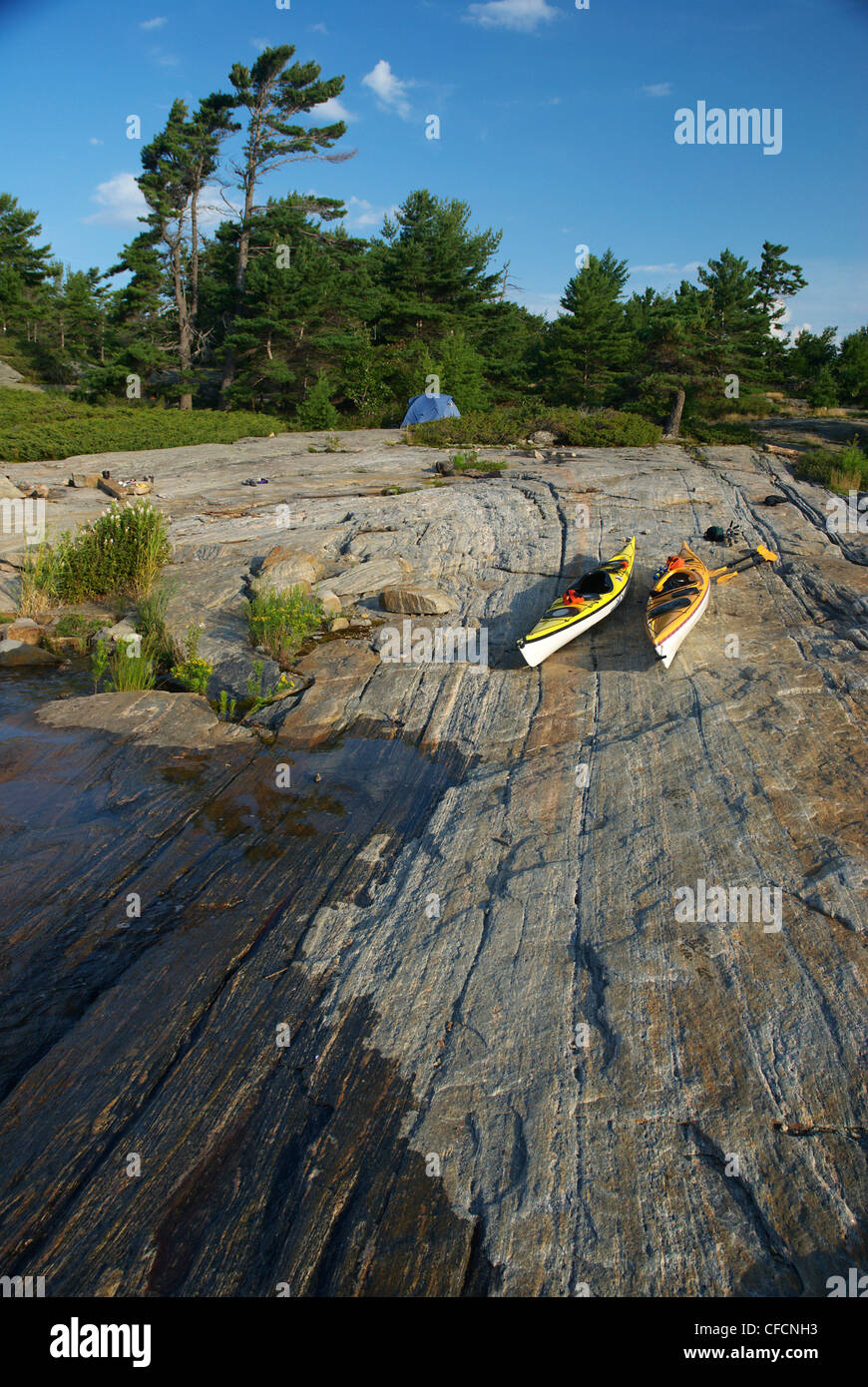 Kayaks pulled up at a campsite on Franklin Island in Georgian Bay near ...