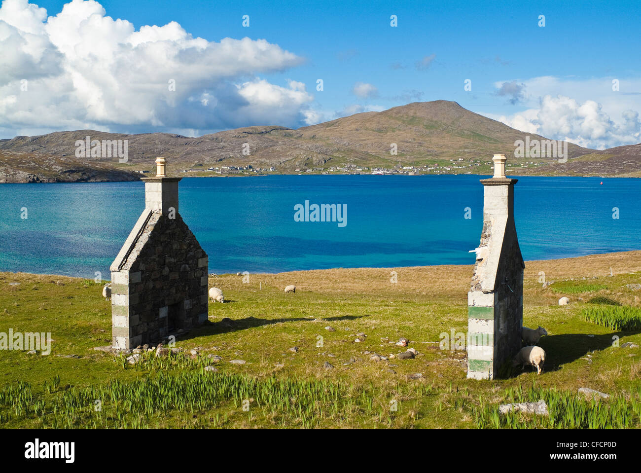 Ruined croft house on Vatersay looking towards the neighbouring island ...