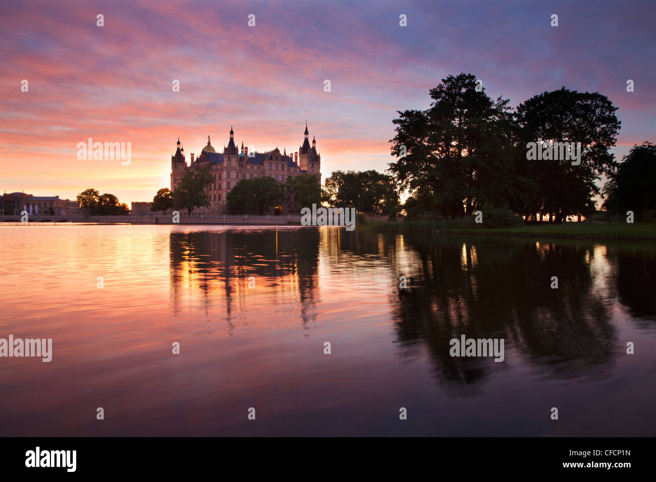 Schwerin Castle at lake Schwerin at sunset, State museum in the ...
