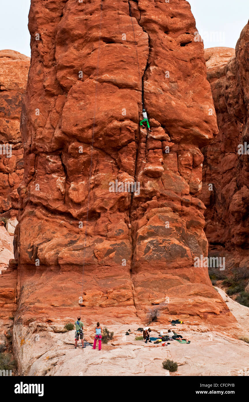 Family rock climbing, Arches National Park, Utah, United States of ...