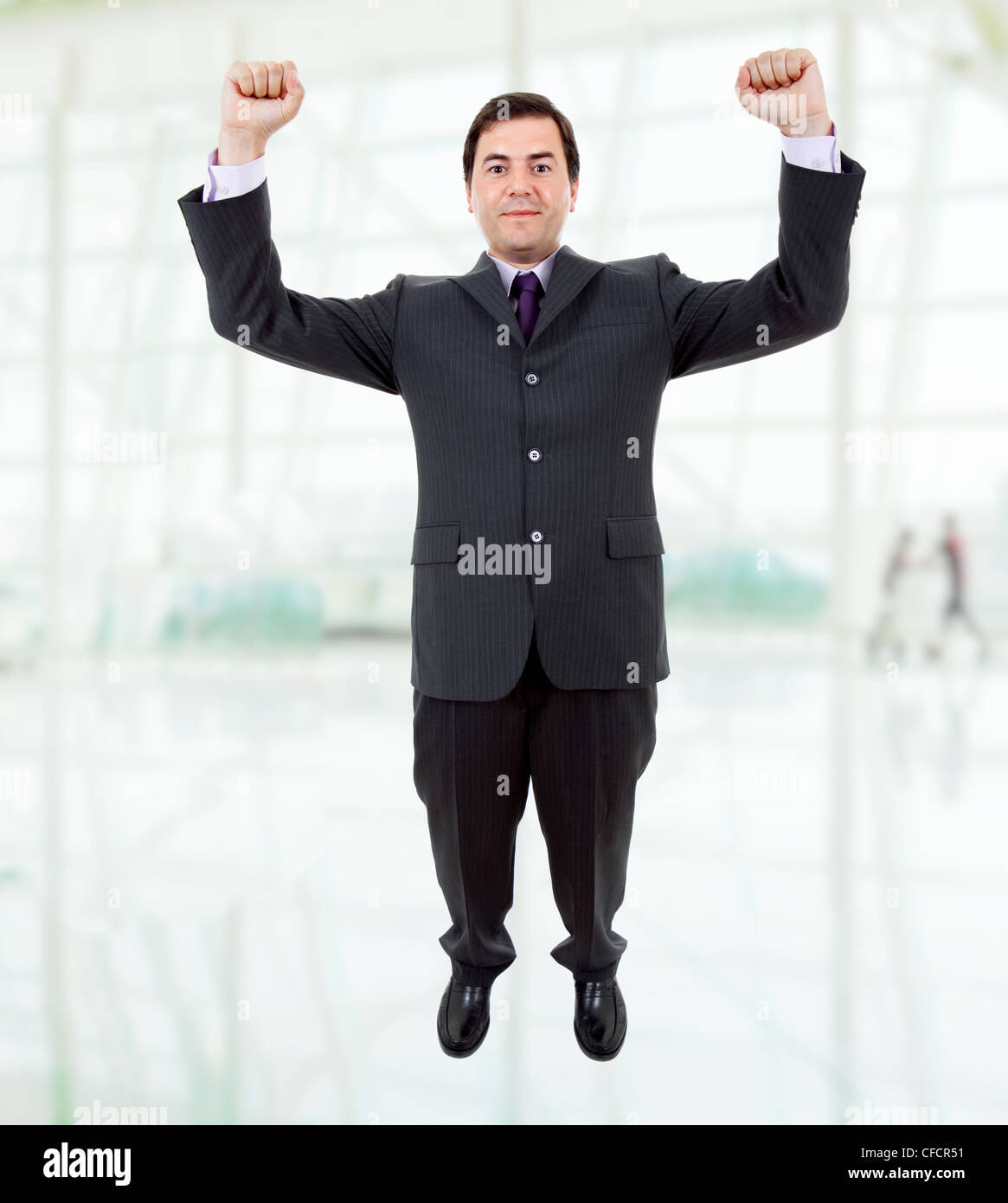 happy young man with wide open arms at the office Stock Photo - Alamy