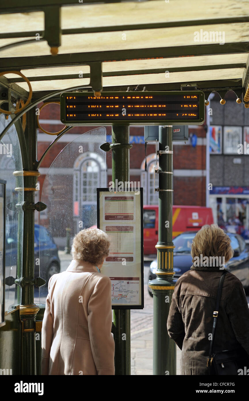 Waiting in a bus stop Horsham town centre looking at timetable Stock ...