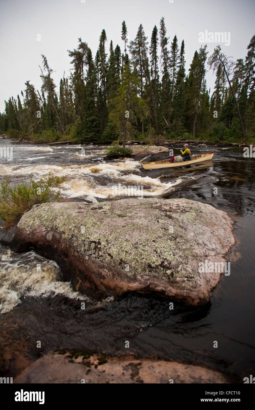 A man canoeing, Wabakimi Provinical Park, Ontario, Canada Stock Photo ...