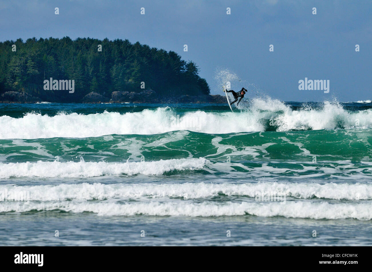 Airborne surfer on surf at Chesterman Beach in Tofino, British Columbia ...
