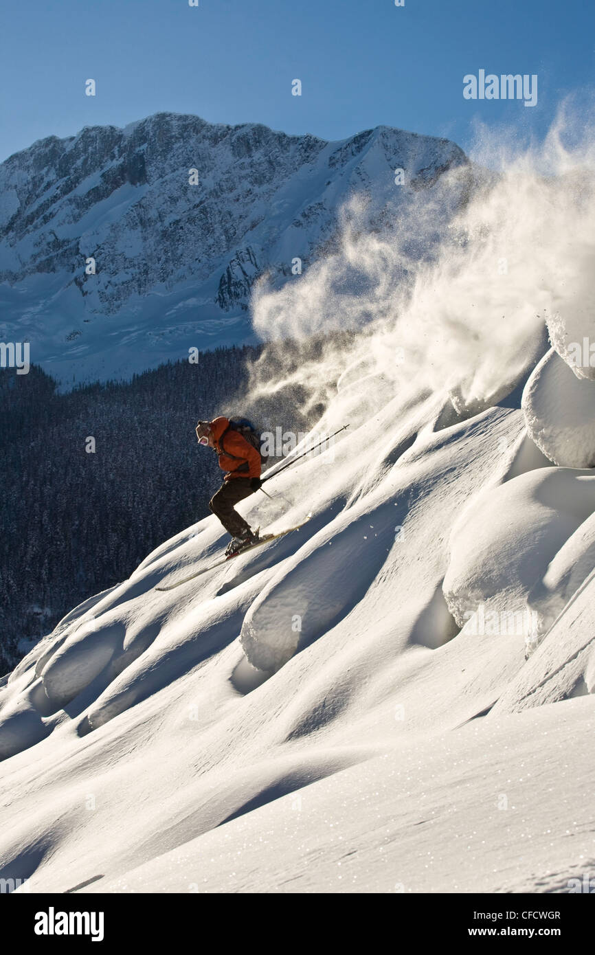 A male freeskier backcountry skiing in Roger's Pass, Glacier National ...