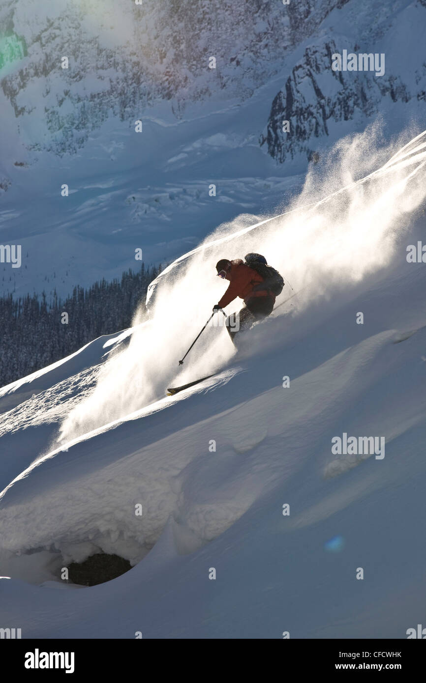 A male freeskier backcountry skiing in Roger's Pass, Glacier National ...