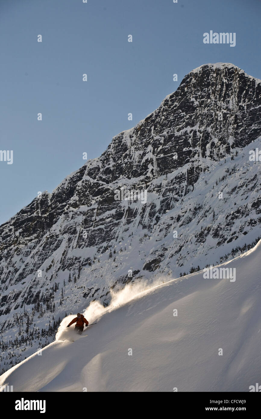 A male freeskier backcountry skiing in Roger's Pass, Glacier National ...